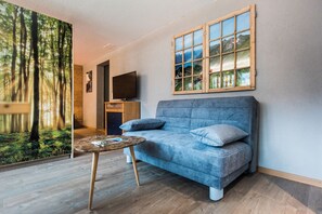 Estúdio standard, vista parcial para o lago | Área de estar