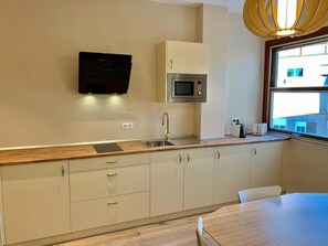 Apartamento Deluxe, cozinha | Cozinha privada