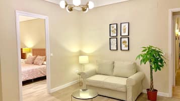 Apartamento luxo, cozinha | Área de estar | TV de tela plana