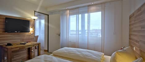 Apartamento Standard | Minibar, secretária, cortinas/cortinados opacos, quartos insonorizados