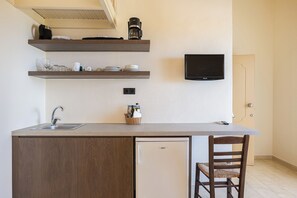 Dúplex, vista para o mar | Kitchenette privada | Minifrigorífico, um micro-ondas, uma placa de cozinha 