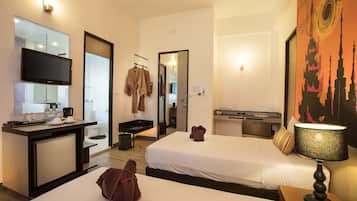 Edredões de penas, minibar com produtos grátis