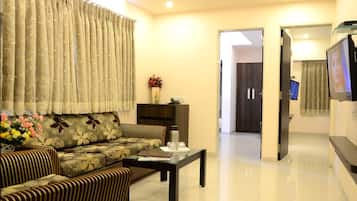 Suite Familiar (AC) | Sala de estar | Televisor LED