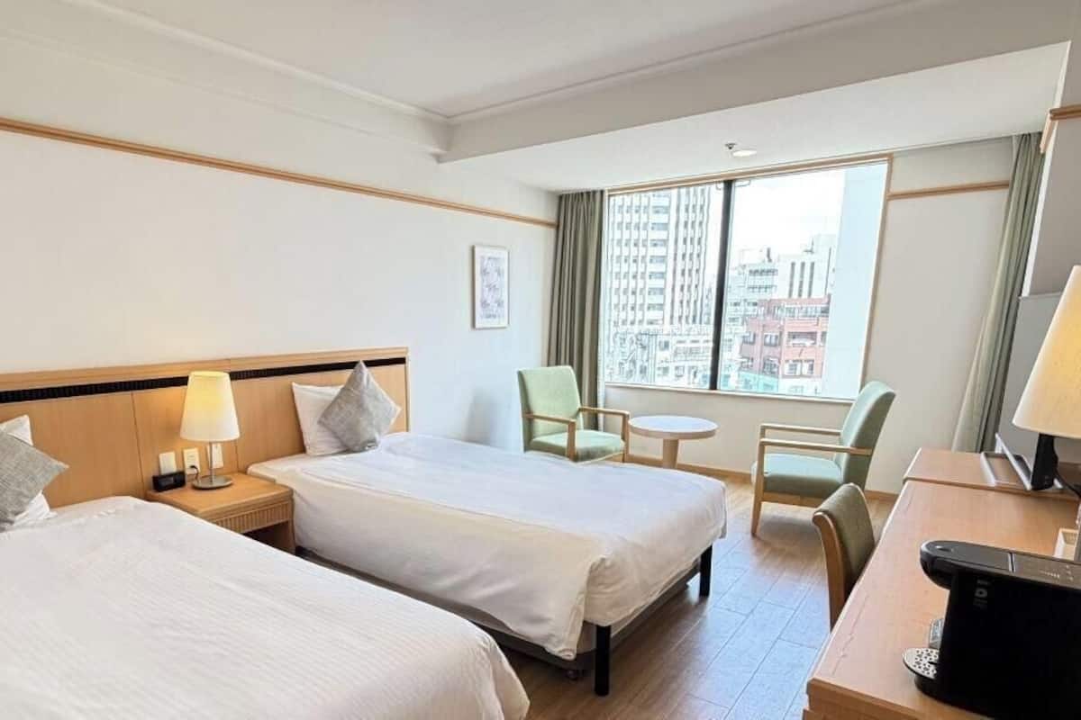 Quarto duplo luxo, para não fumantes | Cortinas blackout, Wi-Fi de cortesia, roupa de cama