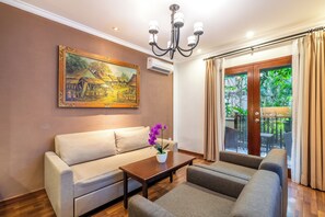 Suíte premier | Área de estar | TV de tela plana