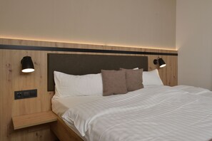 Roupa hipoalergénica, camas de colchão pillowtop, minibar 