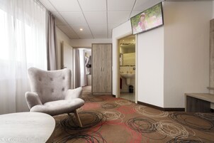 Suite Júnior | Sala de estar | Televisor LCD 