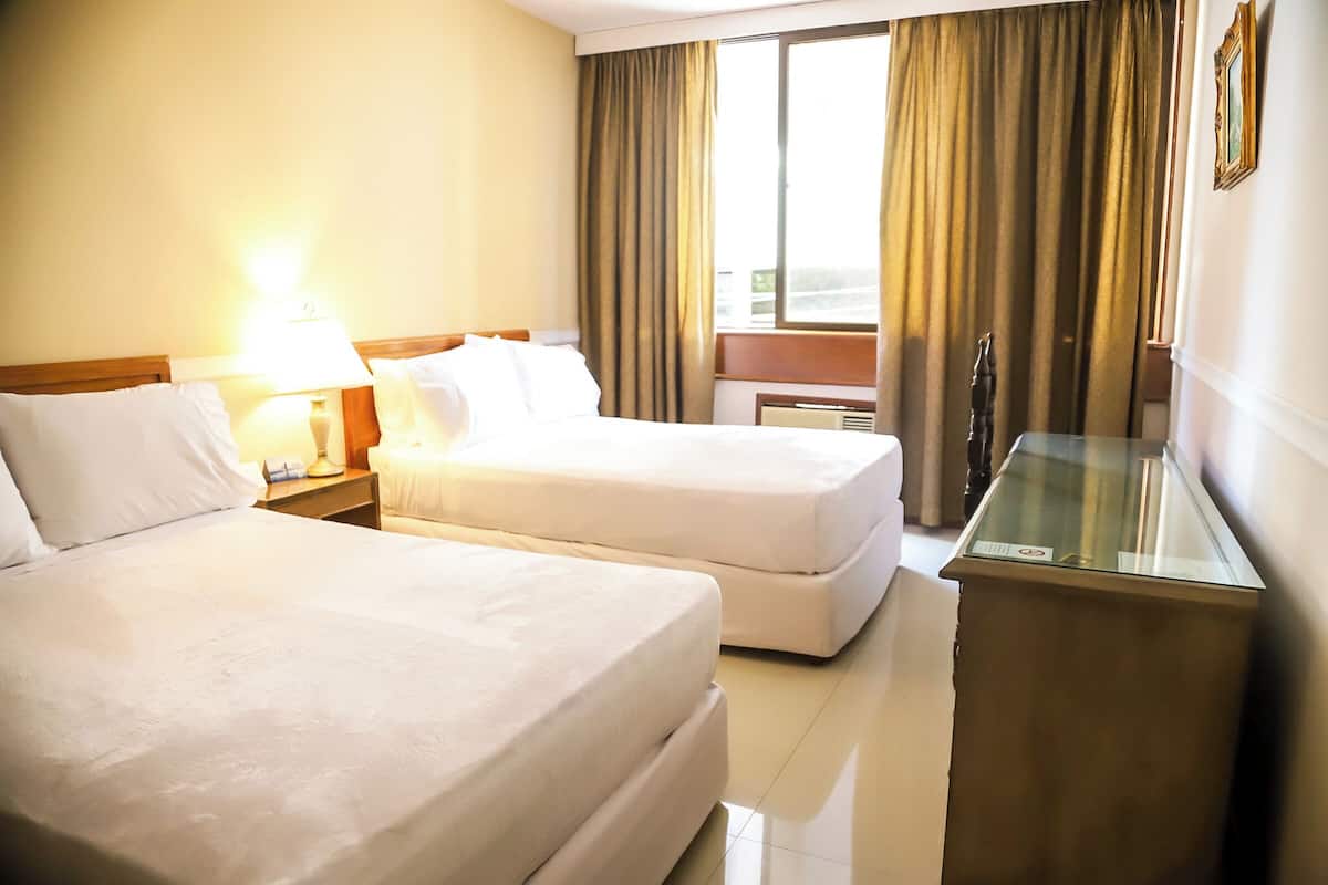 1 quarto, roupa de alta qualidade, camas de colchão pillowtop, minibar