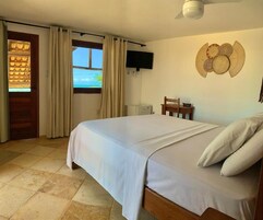 Suíte estúdio superior, vista para o mar (Duplo) | Frigobar, cofres nos quartos, escrivaninha
