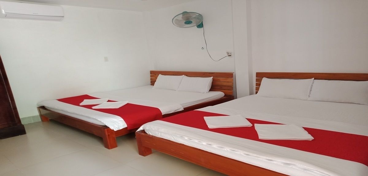 Quarto quádruplo clássico | Frigobar, cofres nos quartos, cortinas blackout