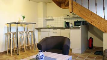 Apartamento | Sala de estar | TV de ecrã plano