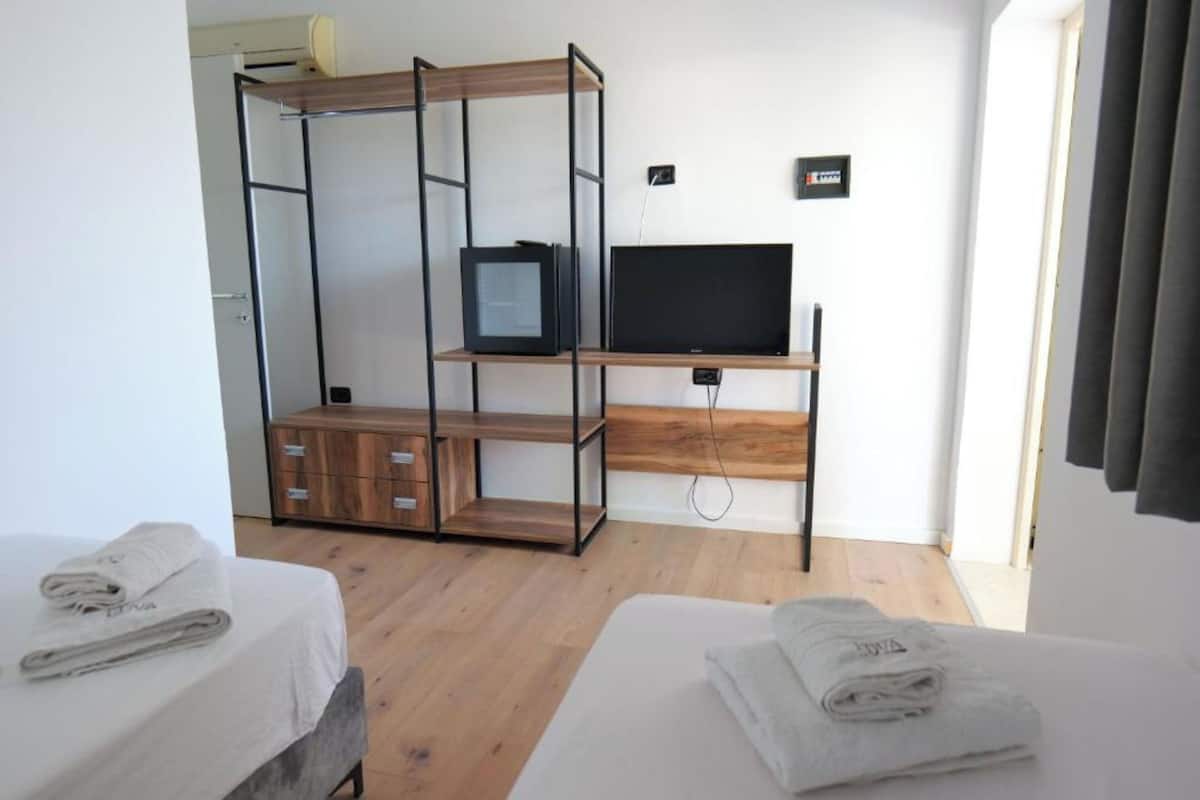 Quarto família, vista para o mar | Escrivaninha, Wi-Fi de cortesia, roupa de cama
