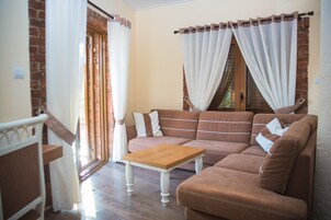 Suíte, sacada | Área de estar | TV LCD