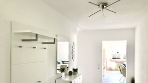 Apartamento conforto, 3 quartos | Área de estar