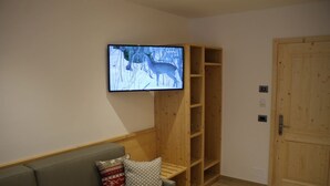 Quarto quádruplo conforto (Dolomia) | Área de estar