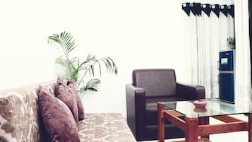 Suite Premium | Sala de estar | Televisor LED de 32 polegadas com canais por cabo, televisor