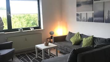 Apartamento Comfort | Sala | TV de ecrã plano