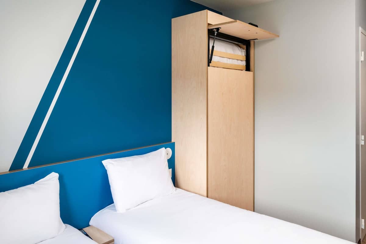 Quartos à prova de som, Wi-Fi de cortesia, roupa de cama
