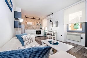 Apartamento urbano | Área de estar | TV de tela plana