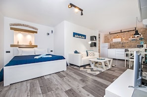 Apartamento urbano | Área de estar | TV de tela plana