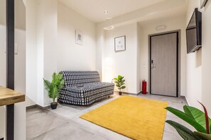 Apartamento, 1 quarto | Sala de estar