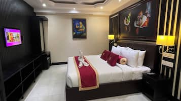Suite Deluxe | 1 quarto, roupa hipoalergénica, minibar