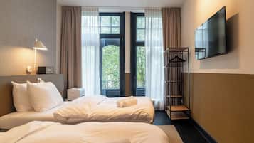 Apartamento, 2 quartos | Roupas de cama premium, cofres nos quartos, cortinas blackout