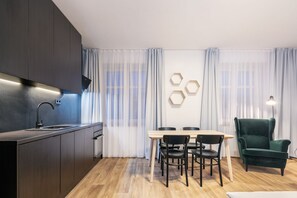 Apartamento Superior | Sala de estar | TV de ecrã plano 