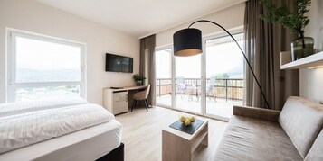 Suite Júnior, varanda | Minibar, cofre no quarto, secretária, quartos insonorizados 