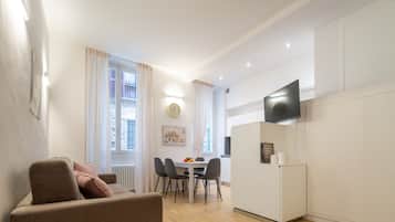 Apartamento conforto | Área de estar | TV de tela plana