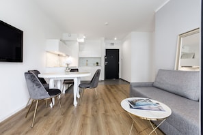 Apartamento conforto | Área de estar | TV de tela plana
