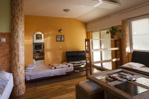 Quarto família | Área de estar | TV de tela plana