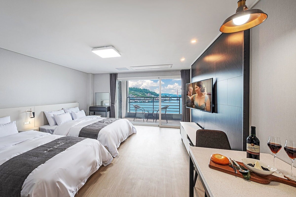 Quarto Deluxe, vista para o oceano | Cortinas/cortinados opacos, Wi-fi grátis, roupa de cama fornecida