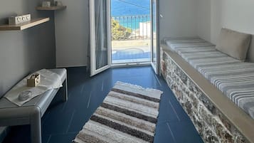 Apartamento Básico, vista para o mar | Sala de estar