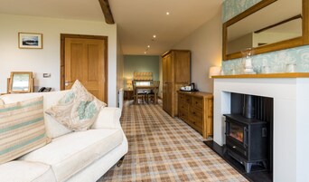 Suíte executiva | Área de estar | TV de tela plana