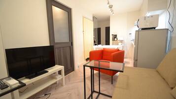 Casa, não fumadores (Private Vacation Home) | Sala de estar | TV de ecrã plano