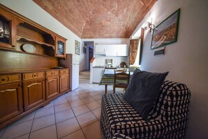 Apartamento, 1 quarto (In Famiglia) | Sala de estar | TV de ecrã plano 