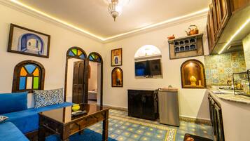 Apartamento luxo | Área de estar | TV de tela plana