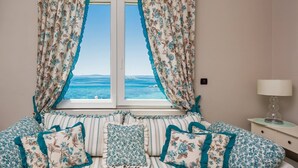 Apartamento panorâmico, 1 quarto, vista para o mar | Sala de estar