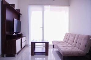 Apartamento, 1 quarto | Sala de estar | TV LCD
