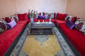 Suíte | Sala de estar | TV de tela plana