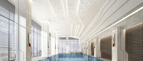 Uma piscina coberta moderna com design elegante, amplas janelas e teto decorado.