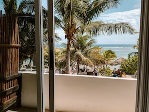 Quarto superior, vista para o oceano | Terraço/pátio