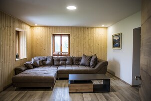 Apartamento Deluxe | Sala de estar