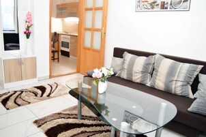 Apartamento grand | Área de estar | TV LCD