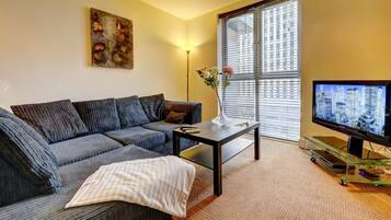 Apartamento conforto | Sala de estar | TV de tela plana