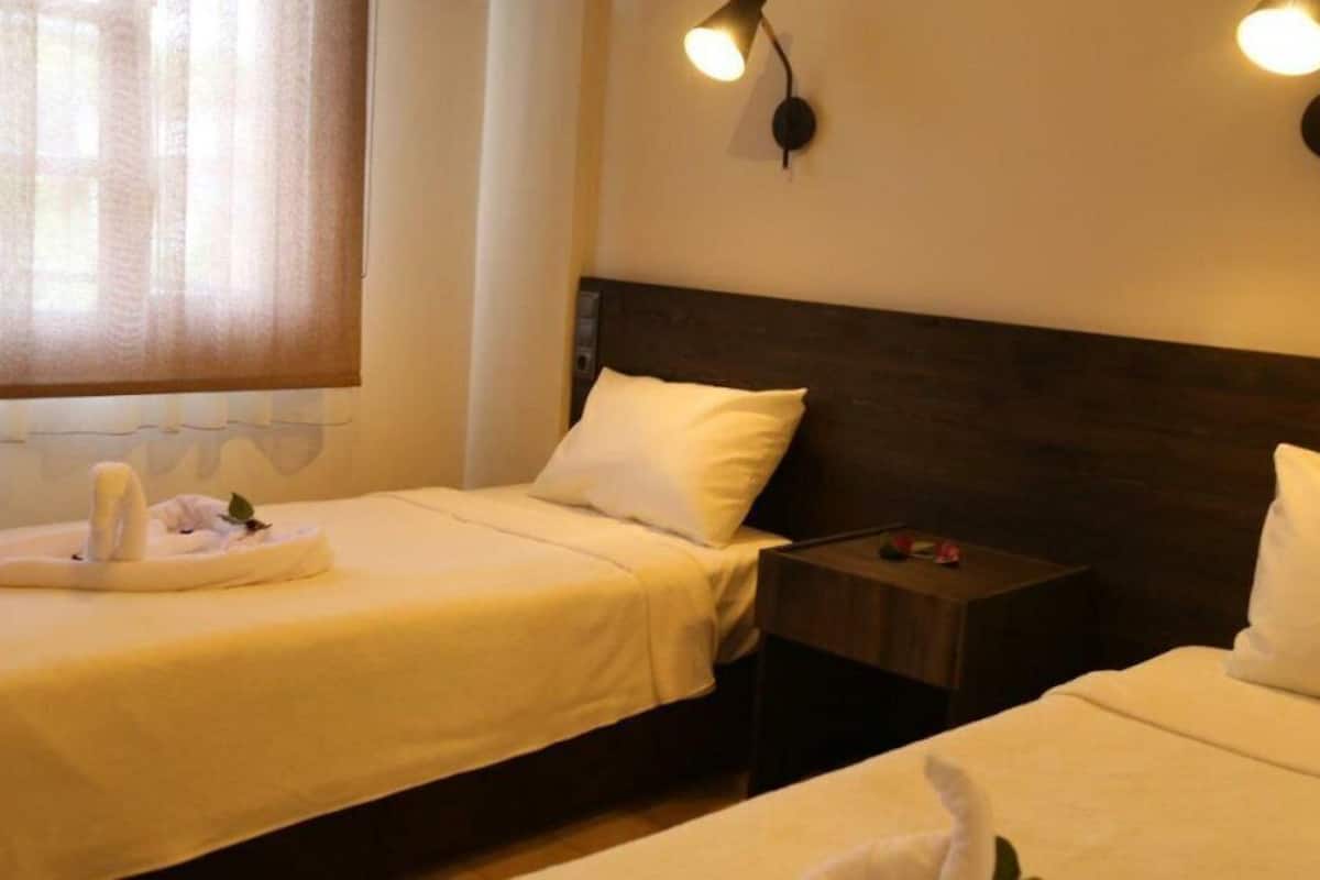 Quarto solteiro standard | Quartos à prova de som, berços grátis, Wi-Fi de cortesia, roupa de cama