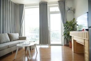 Apartamento, 1 quarto | Área de estar | Smart TV