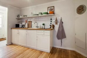 Apartamento, 1 quarto (102) | Cozinha americana privada | Geladeira, micro-ondas, cooktop, cafeteira/chaleira