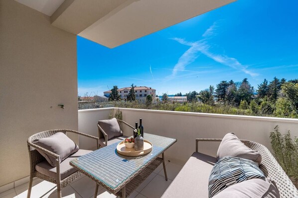 Apartamento superluxo, vista para o jardim | Sacada